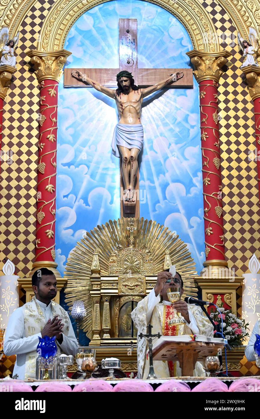 NOIDA, INDIA - MARCH 31: Priest leads prayers on the occasion of Easter ...