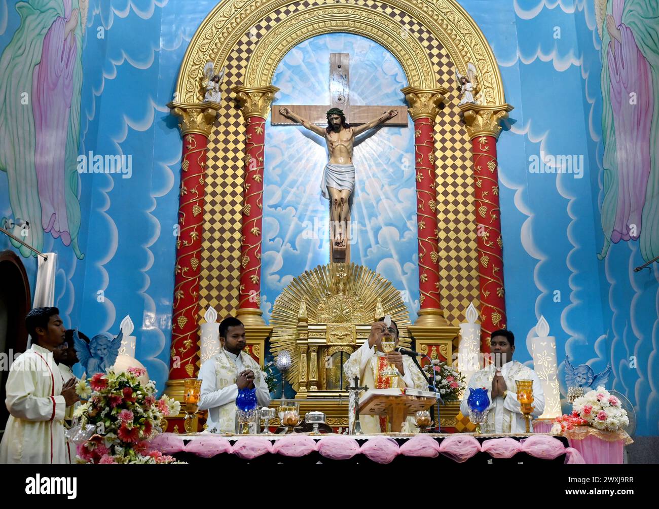NOIDA, INDIA - MARCH 31: Priest leads prayers on the occasion of Easter ...