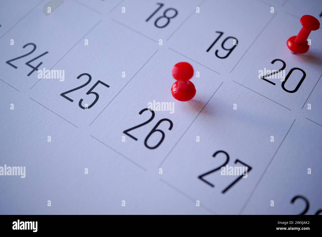 Drawing pin on the calendar, days of the month Stock Photo - Alamy