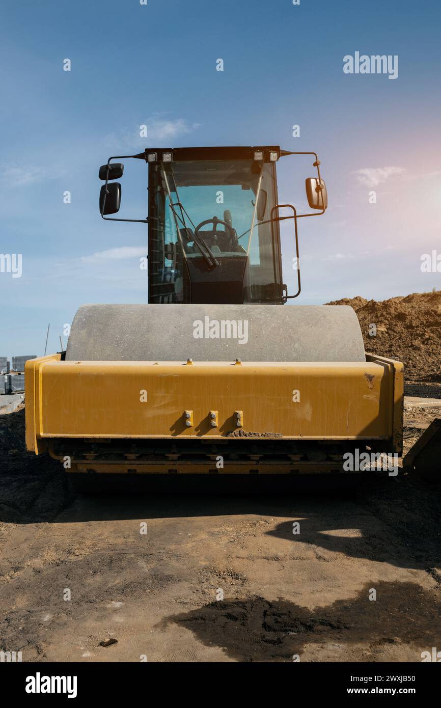 industrial machine working on road construction. heavy work Stock Photo ...