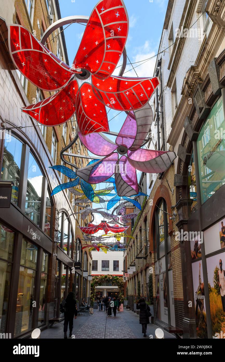 Floral artwork above Slingsby Street, London Stock Photo - Alamy