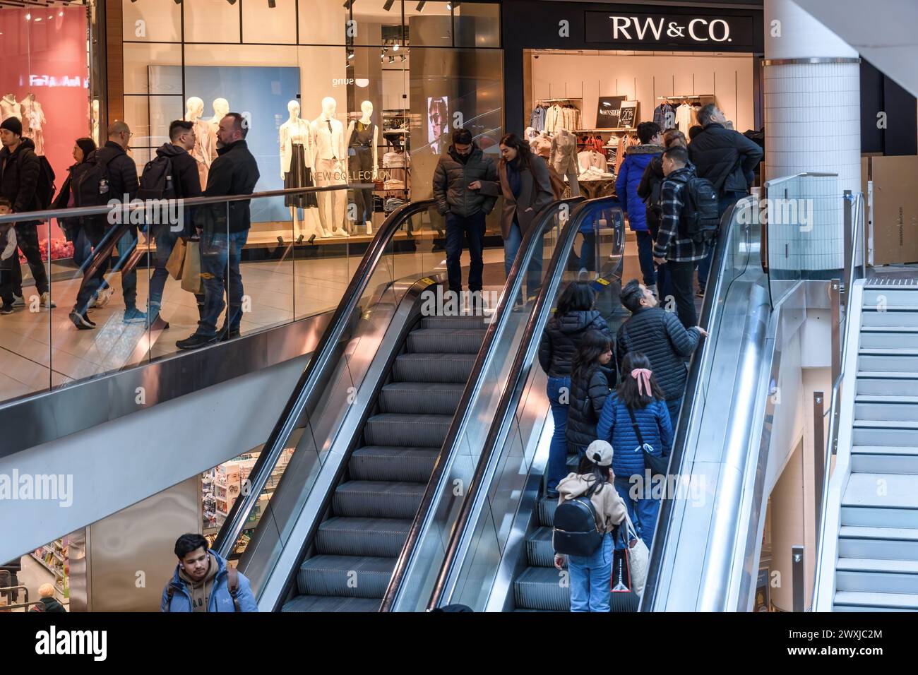 People on escalators inside a shopping mall, Toronto, Canada Stock ...
