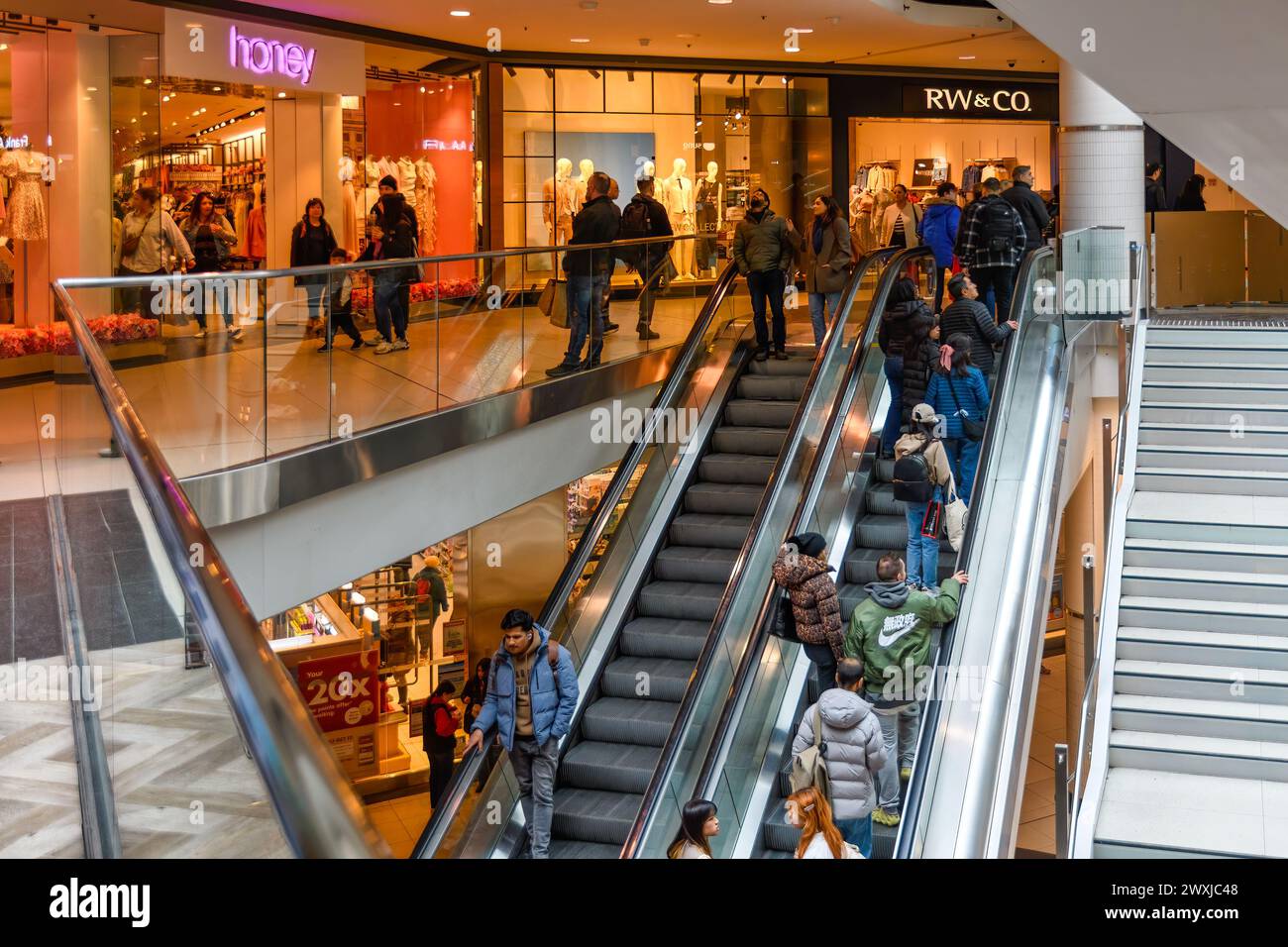 People on escalators inside a shopping mall, Toronto, Canada Stock ...
