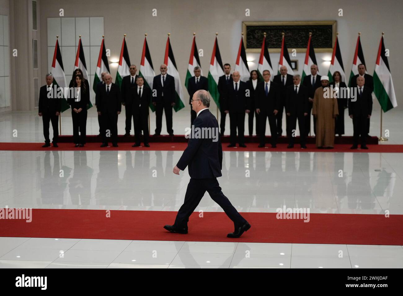 Newly appointed Palestinian Prime Minister Mohammad Mustafa walks ...