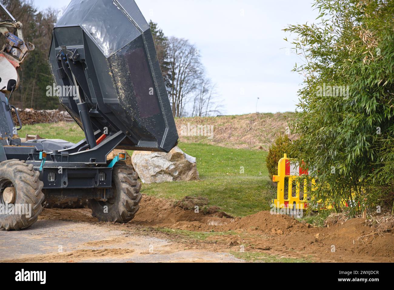 Earth Removal With Wheel Dumper On The Construction Site - Construction ...