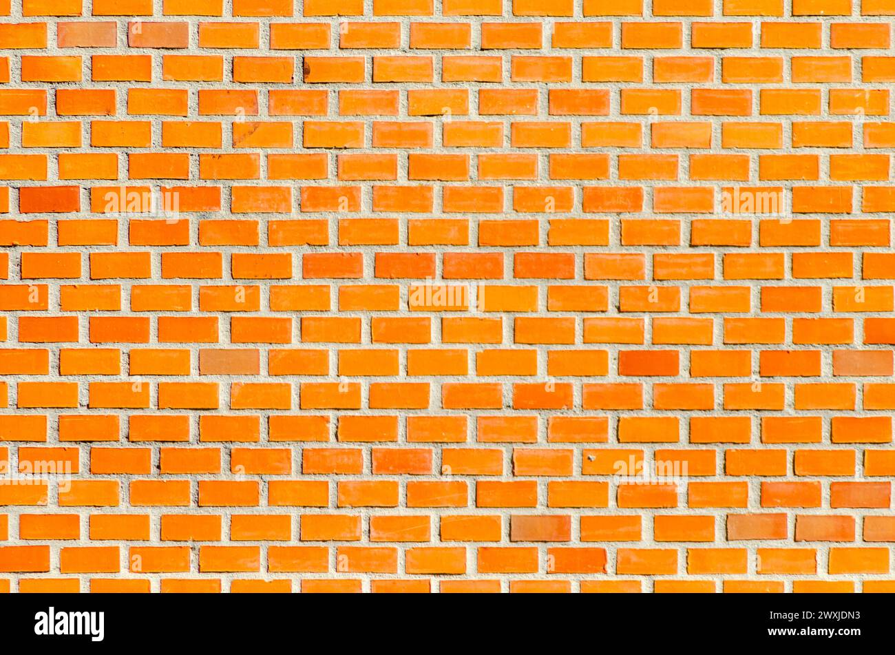 texture of an orange brick wall, background for design Stock Photo - Alamy