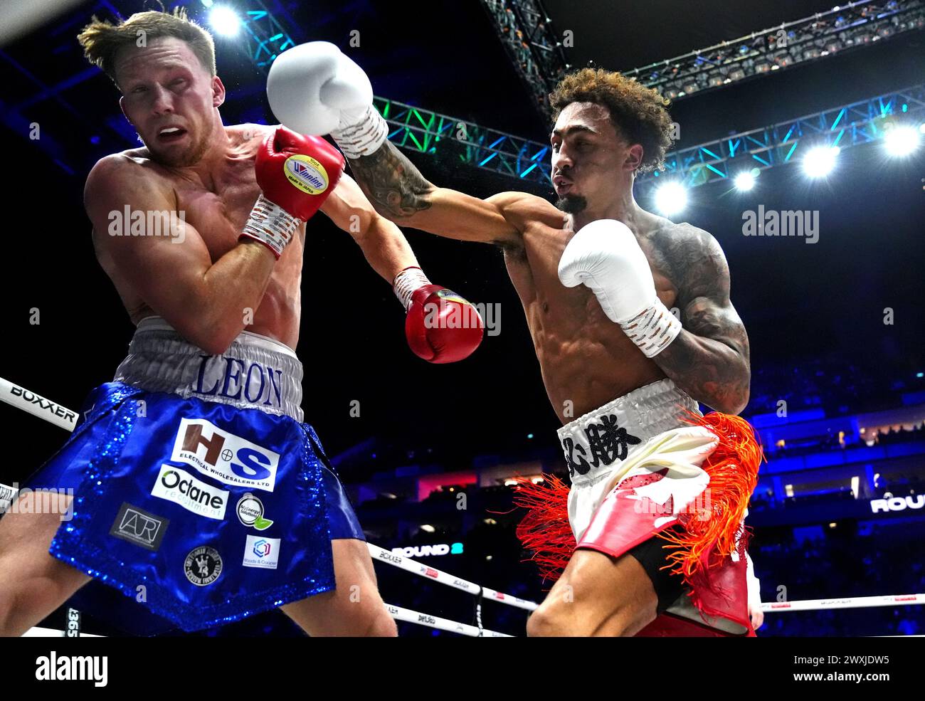 Ben Whittaker (right) and Leon Willings in action during their light ...