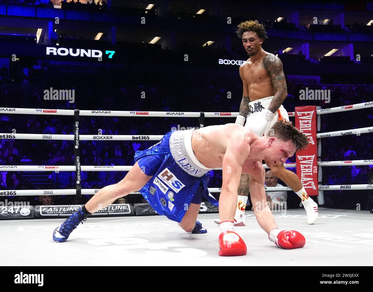 Ben Whittaker knocks down (left) Leon Willings during their light heavy ...