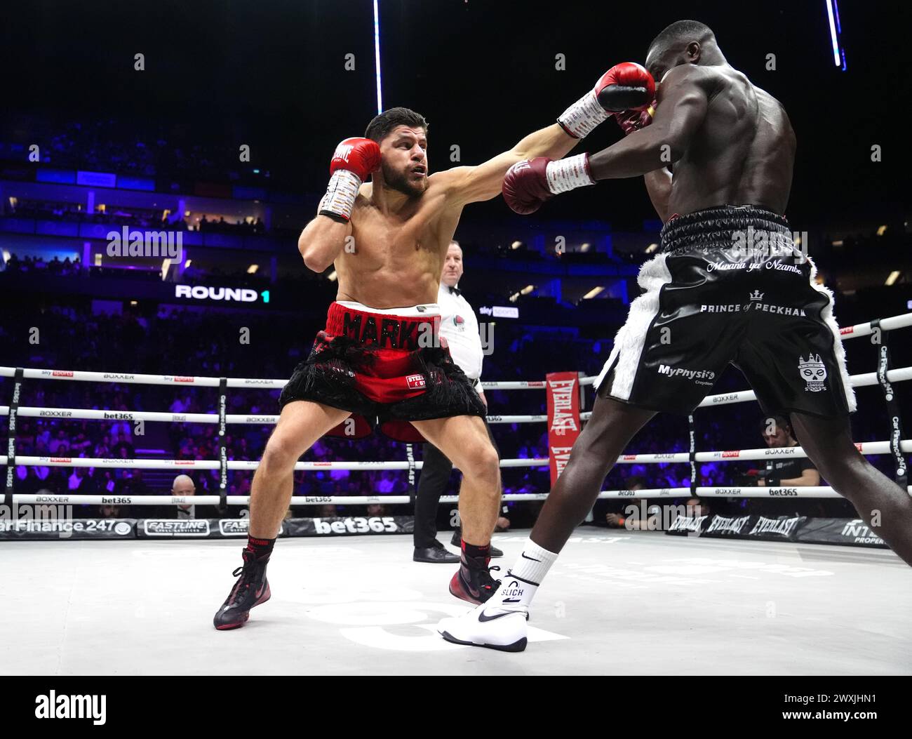 Florian Marku (left) and Chris Kongo in action during their welter ...