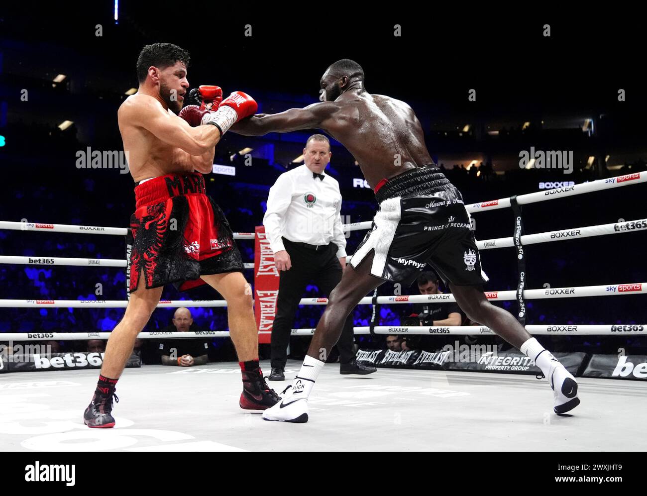 Florian Marku (left) and Chris Kongo in action during their welter ...