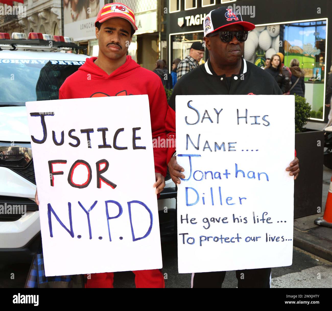 New York, New York, USA. 31st Mar, 2024. Two men hold signs in support ...