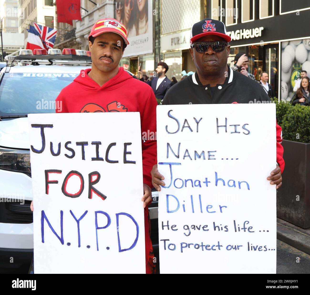 New York, New York, USA. 31st Mar, 2024. Two men hold signs in support ...