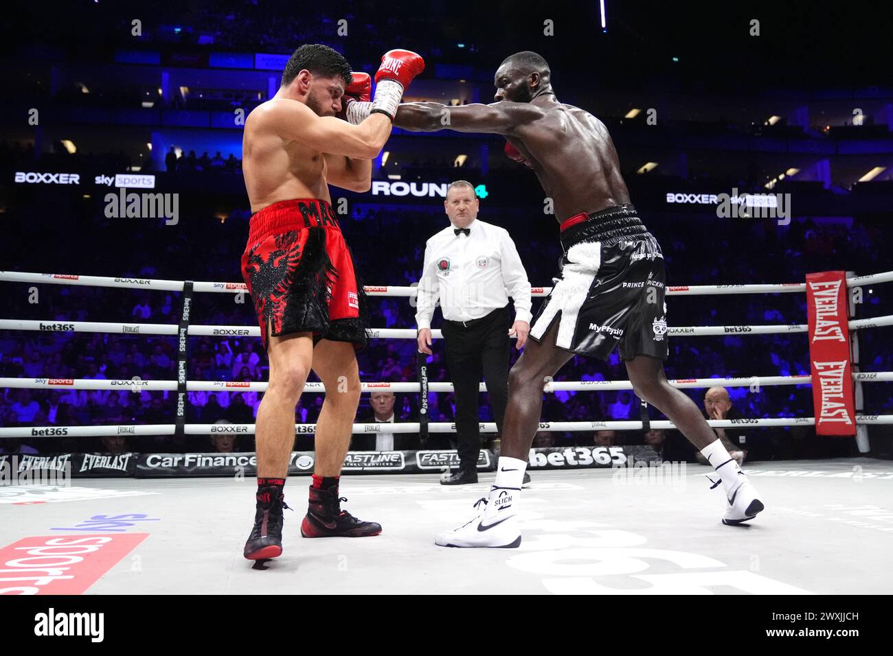 Florian Marku (left) and Chris Kongo in action during their welter ...