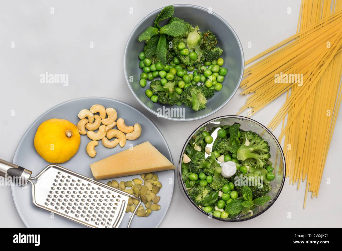 Broccoli pasta. Green peas, mint and broccoli in blender and in bowl ...