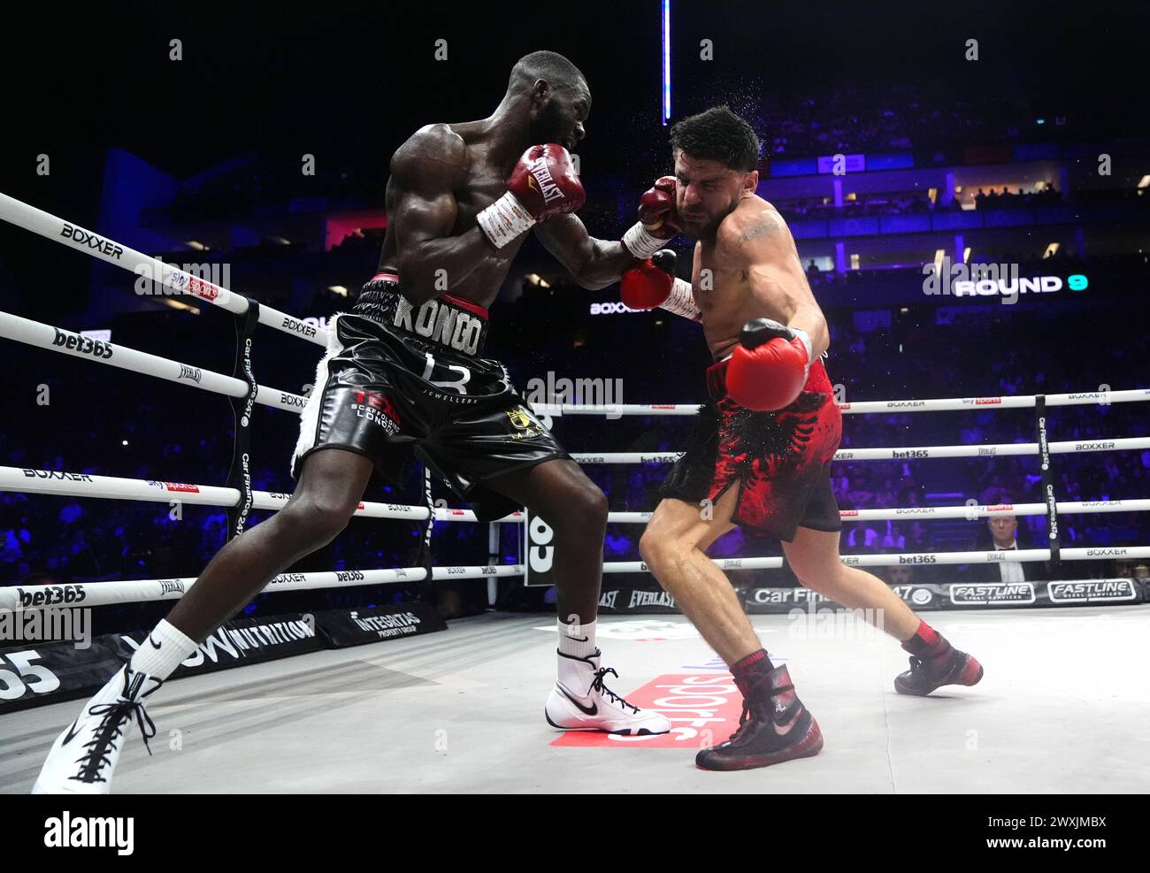 Florian Marku (right) and Chris Kongo in action during their welter ...