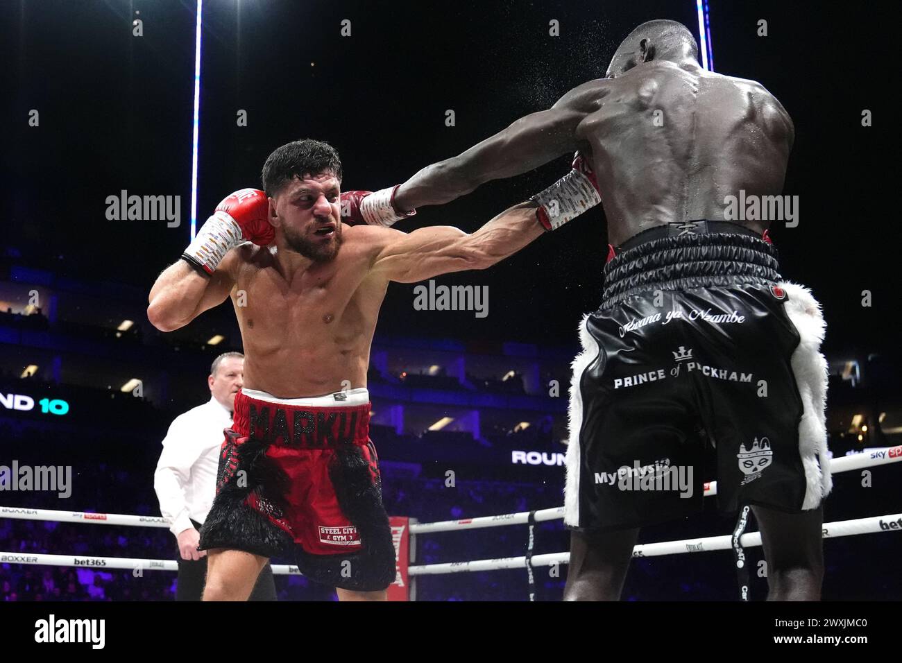 Florian Marku (left) and Chris Kongo in action during their welter ...