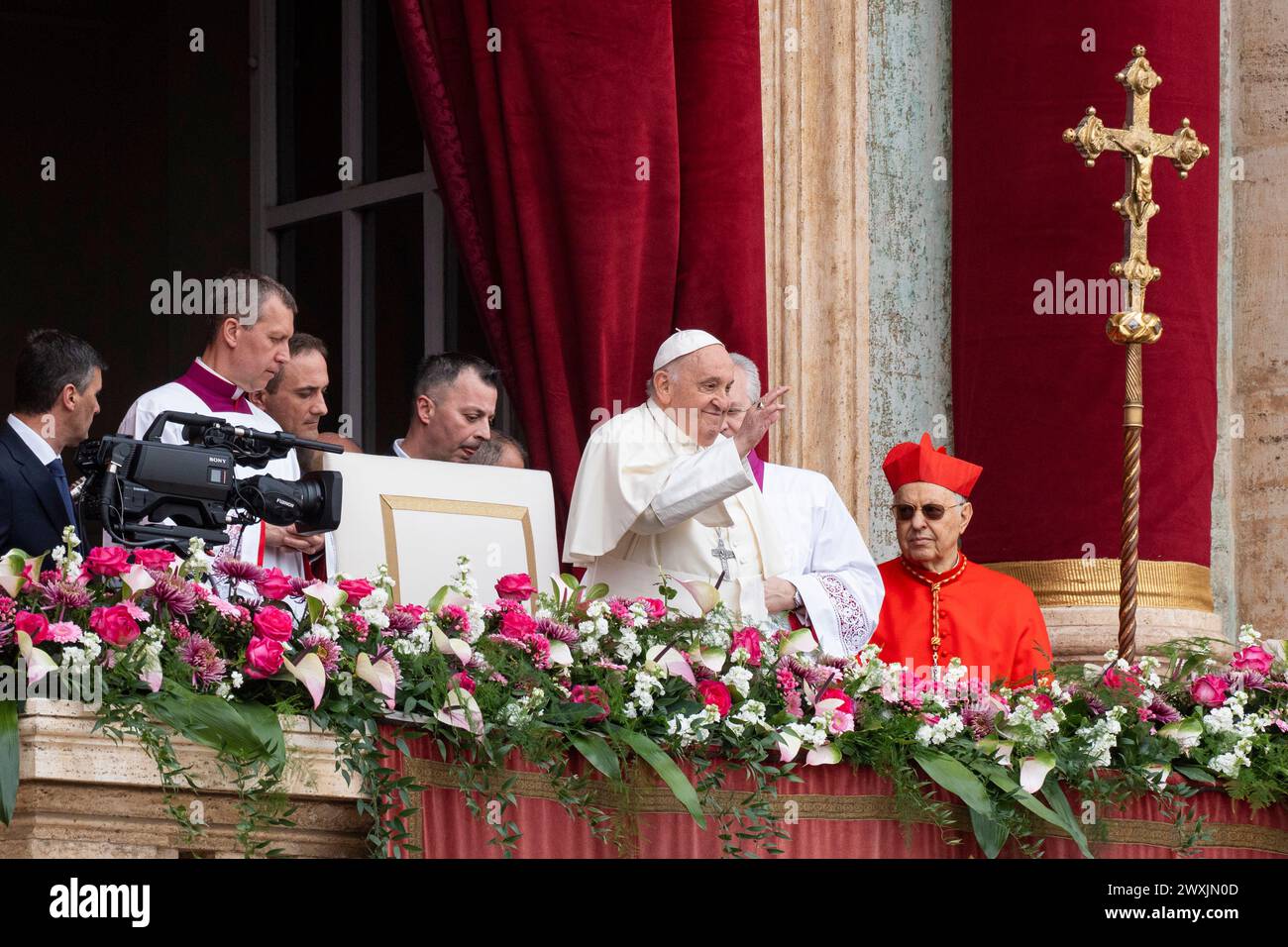 Pope Francis bids farewell before leaving the central balcony of St. Peter's Basilica at the end ...