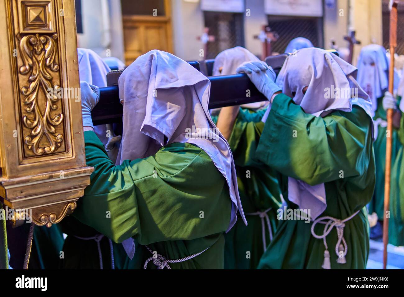 Ceremonial Procession with Green Robes and Candlelit Structure Stock ...