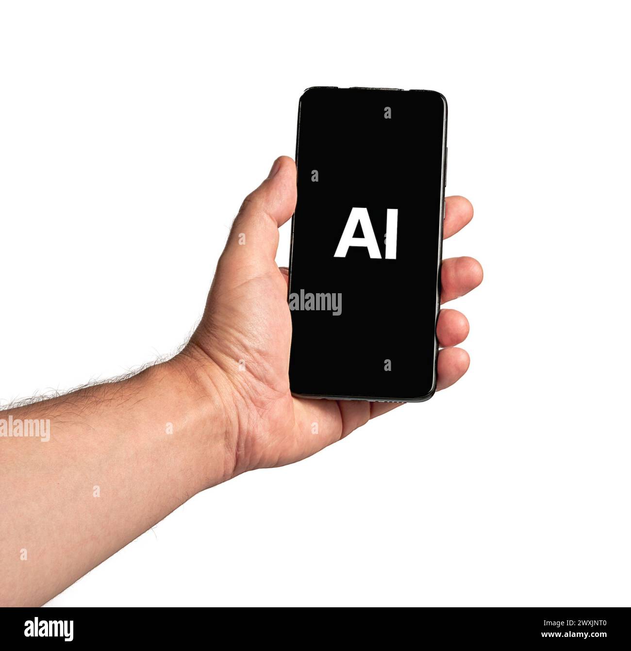 Hand holding a mobile phone displaying "AI", indicating artificial ...