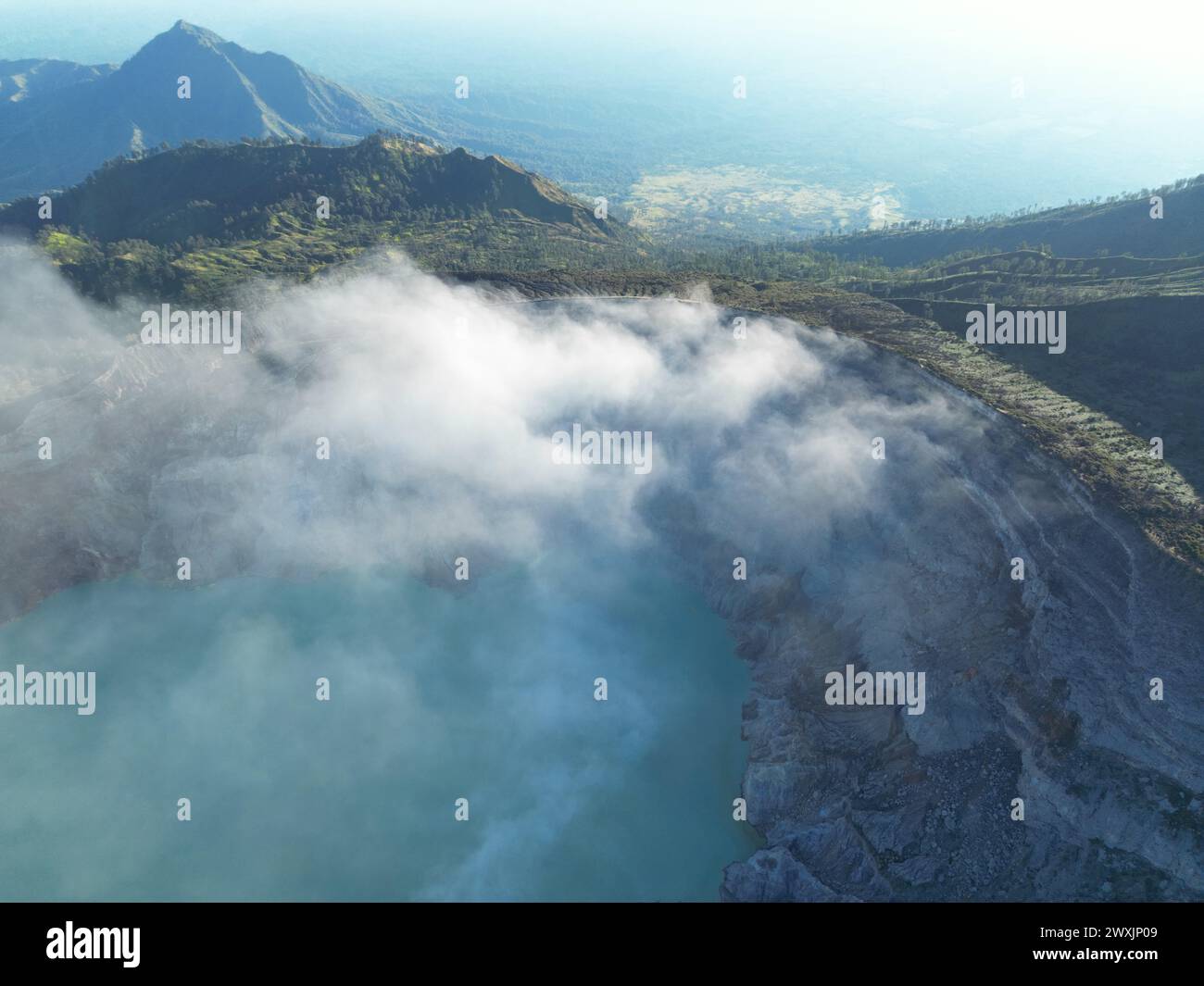 Breathtaking aerial view of majestic Ijen volcano crater mountain range ...
