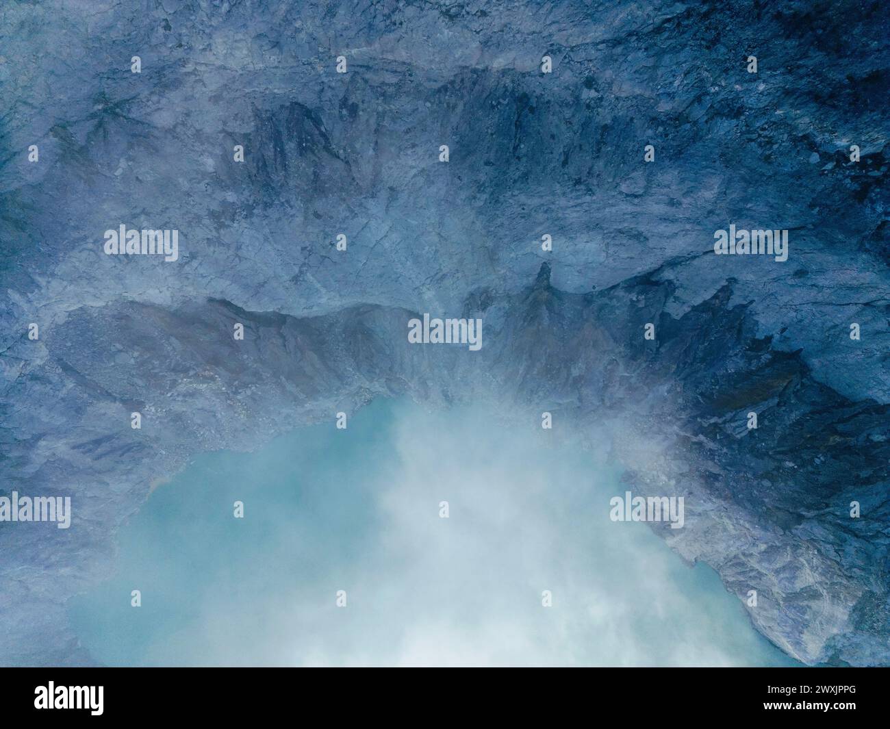 Top view of Ijen rocky mountain volcano with a crater hole in the ...