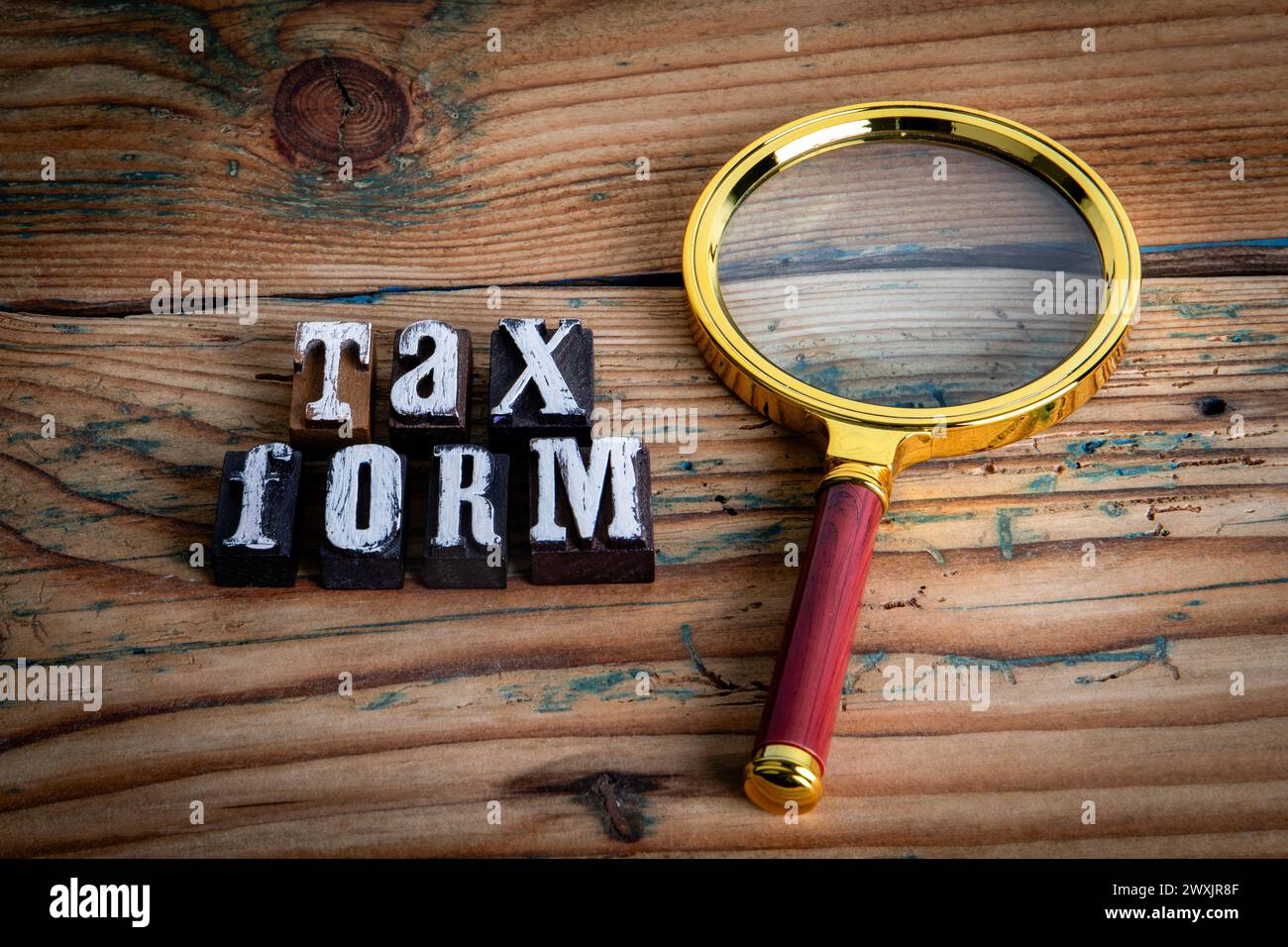 TAX FORM. Alphabet letters on wood texture background Stock Photo - Alamy