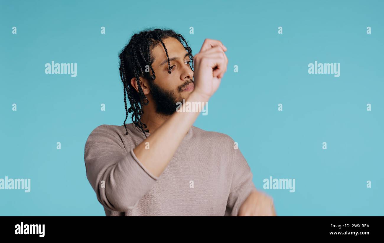 Middle Eastern conductor performing classical music concert following ...