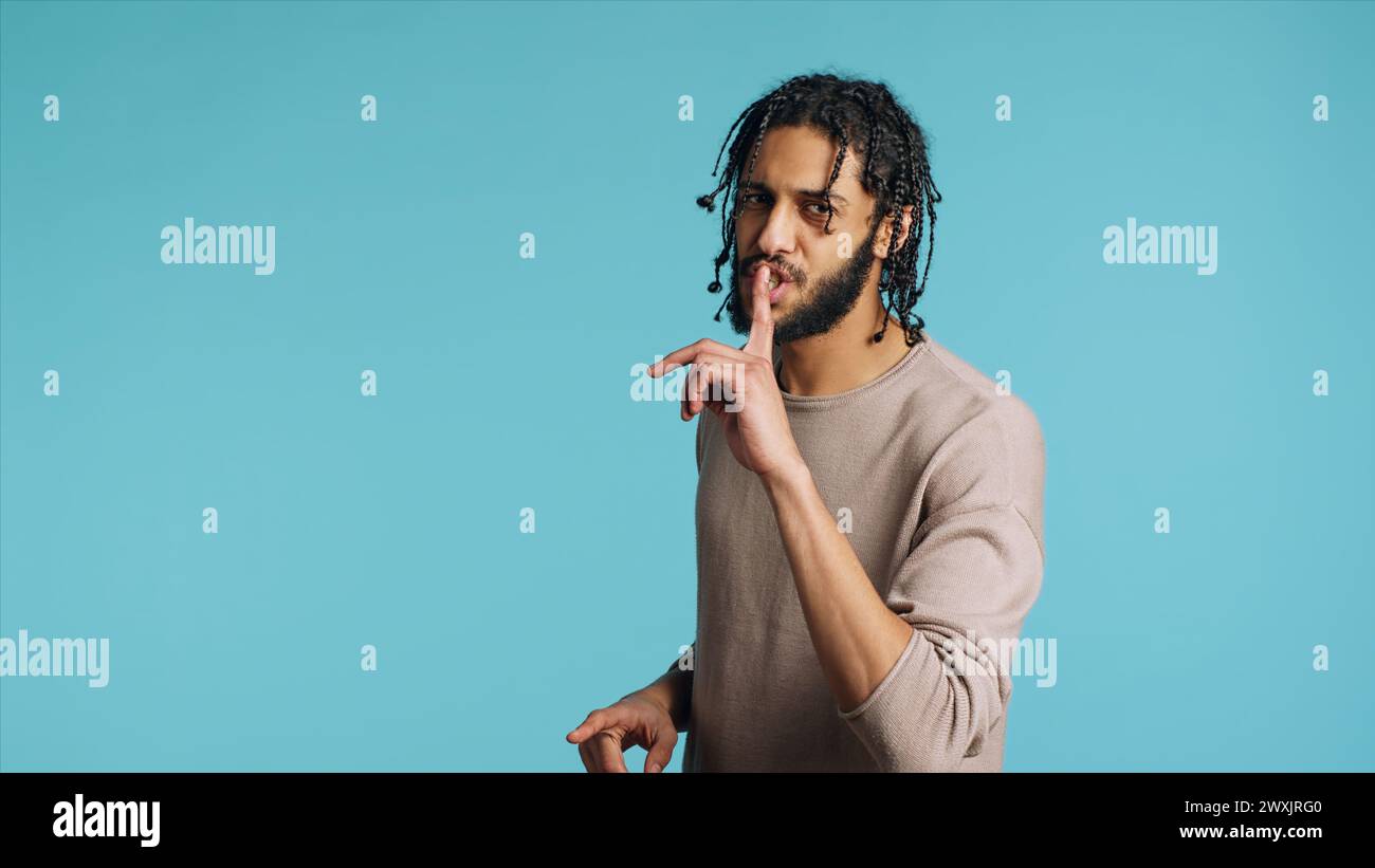 Middle Eastern man pretending to fight, throwing punches, holding ...
