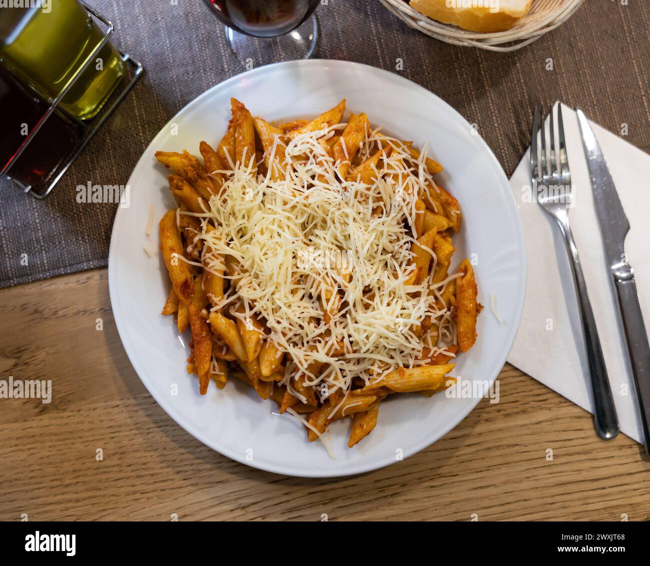 Pasta bolognese with cheese served on platter Stock Photo - Alamy