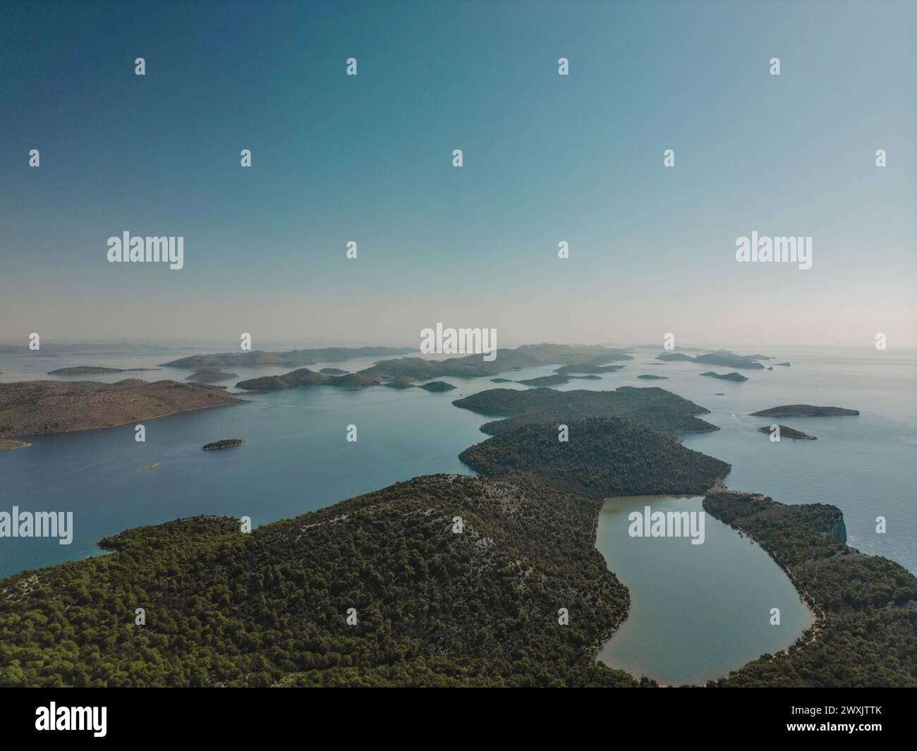 Drone aerial view of sunny landscape with sea inlets and islands of ...