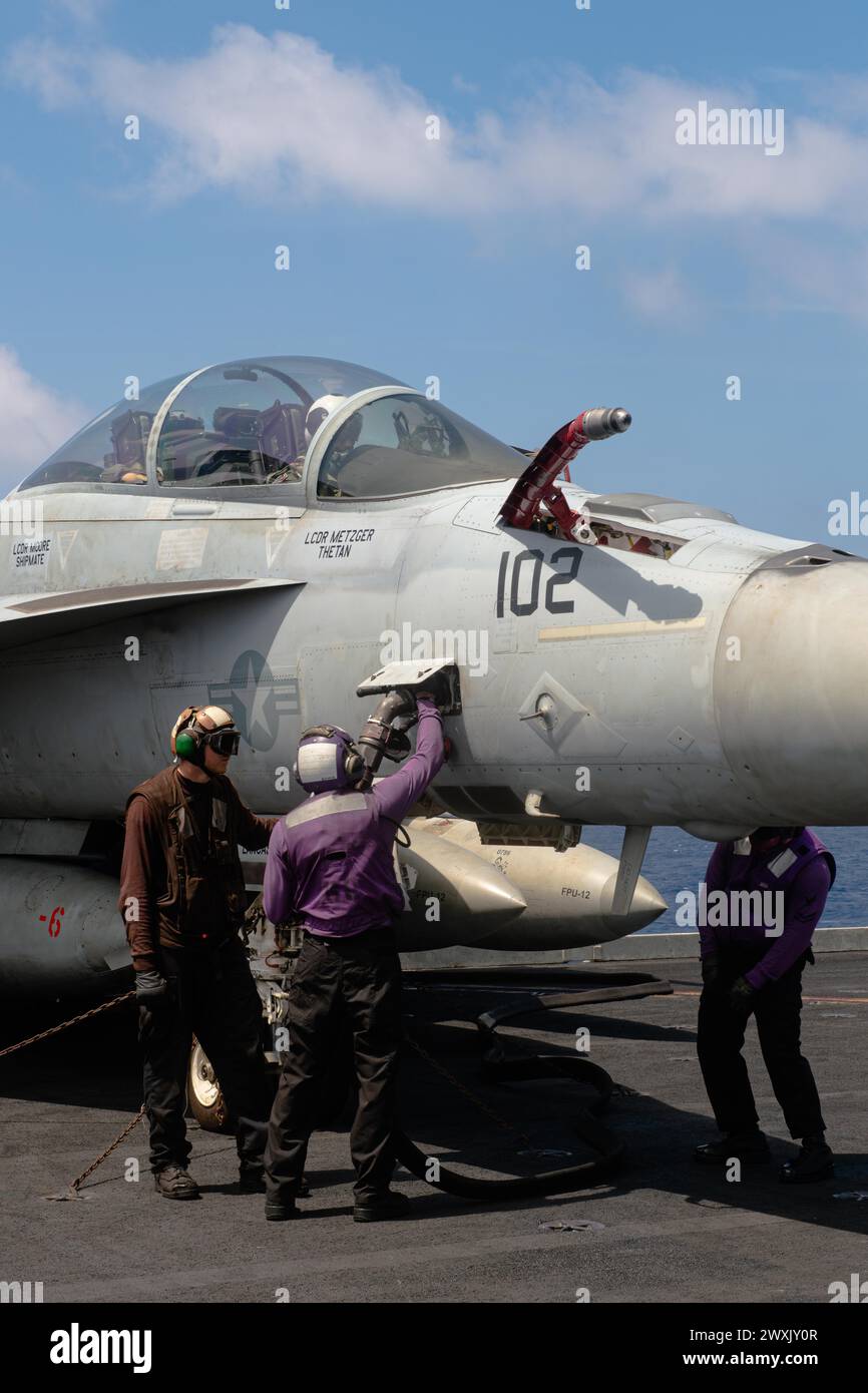 SOUTH CHINA SEA (March 16, 2024) U.S. Sailors prepare an F/A-18F Super ...