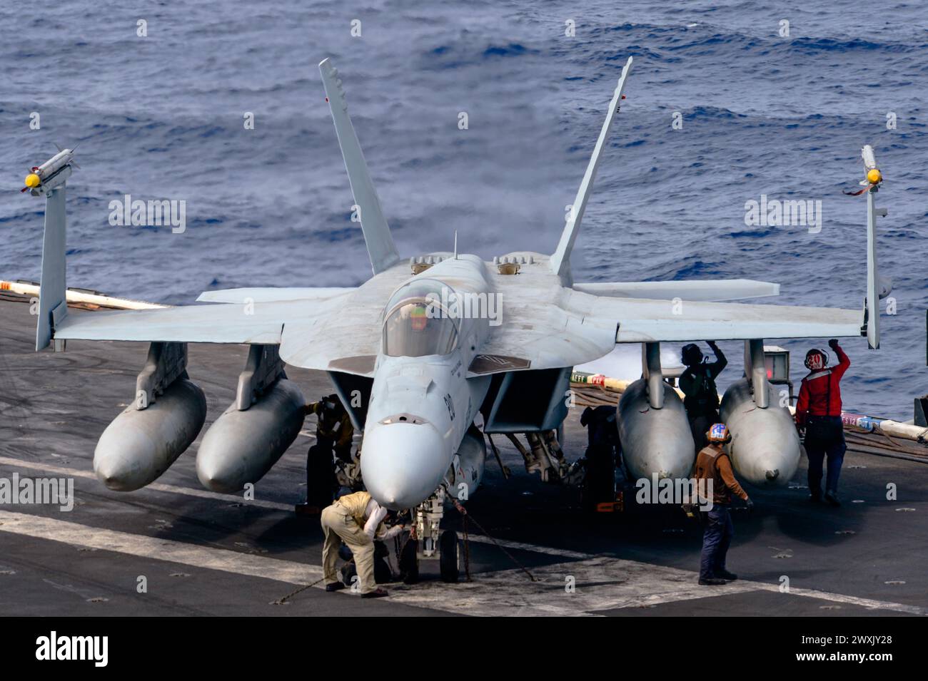 SOUTH CHINA SEA (March 27, 2024) U.S. Sailors prepare an F/A-18E Super ...
