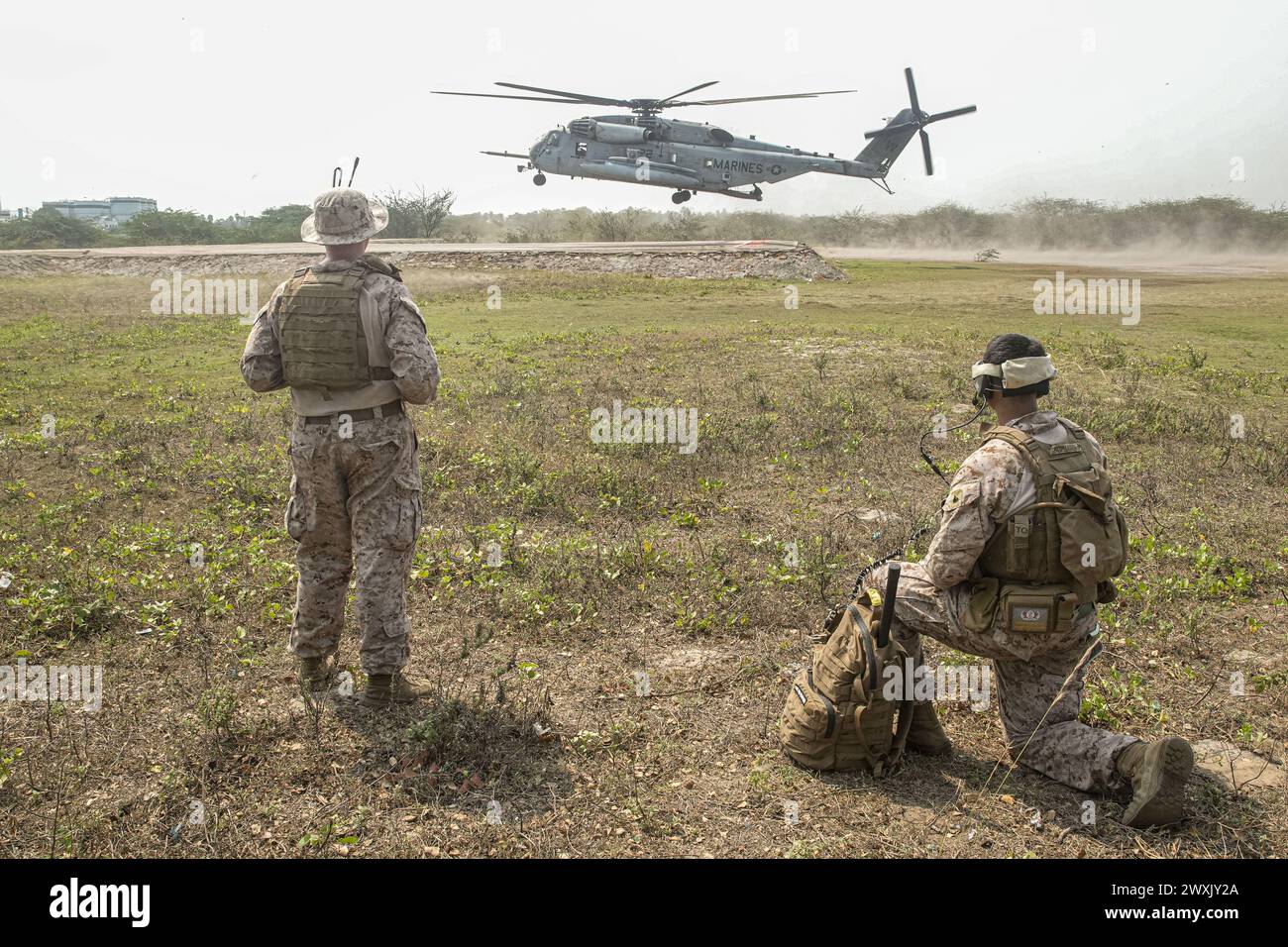 U.S. Marine Corps Cpl. Preston Bernardi, right, an air traffic ...