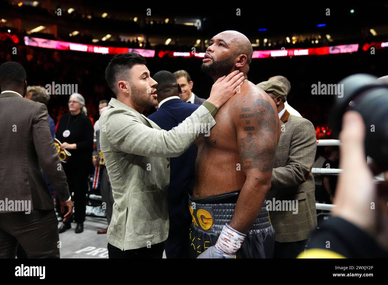 Frazer Clarke speaks to Ben Shalom (left) after his fight against Fabio ...