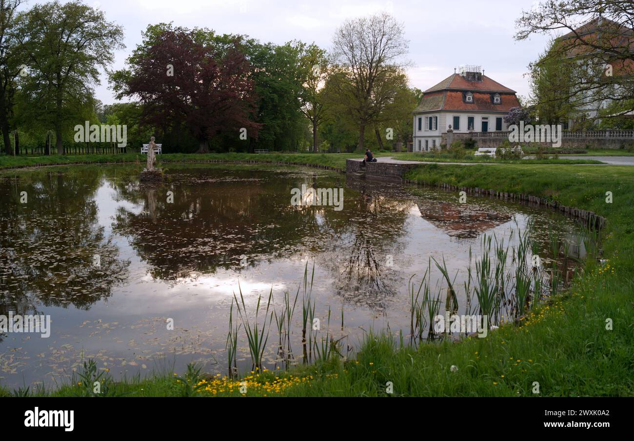 Pond in the park of the Fasanerie Castle, view in the early evening ...