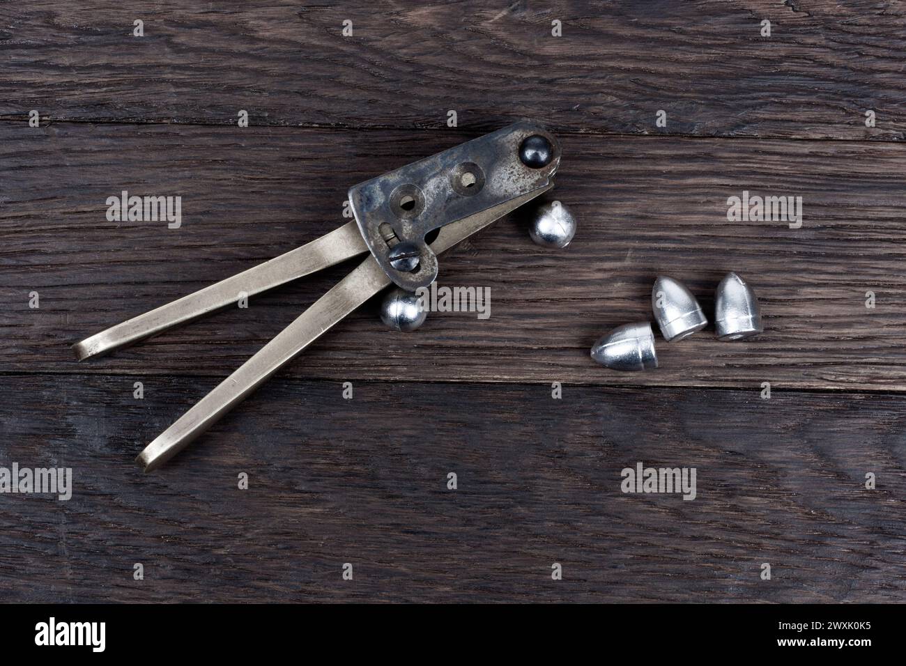 Antique old west bullet mold with bullets for revolver. Isolated on ...