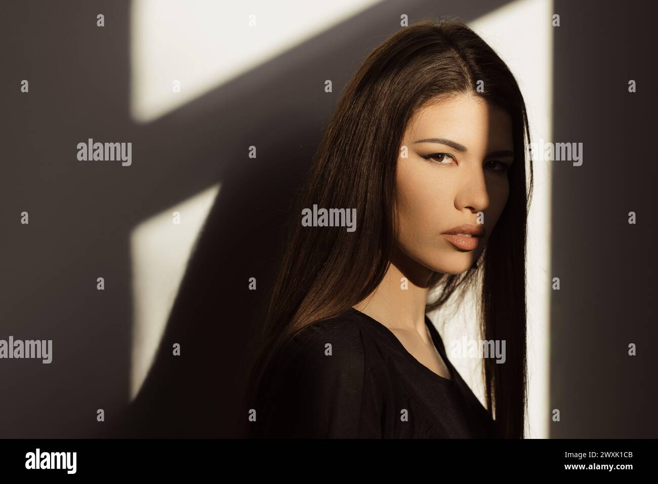 Mystery woman with dramatic lighting and shadow Stock Photo - Alamy