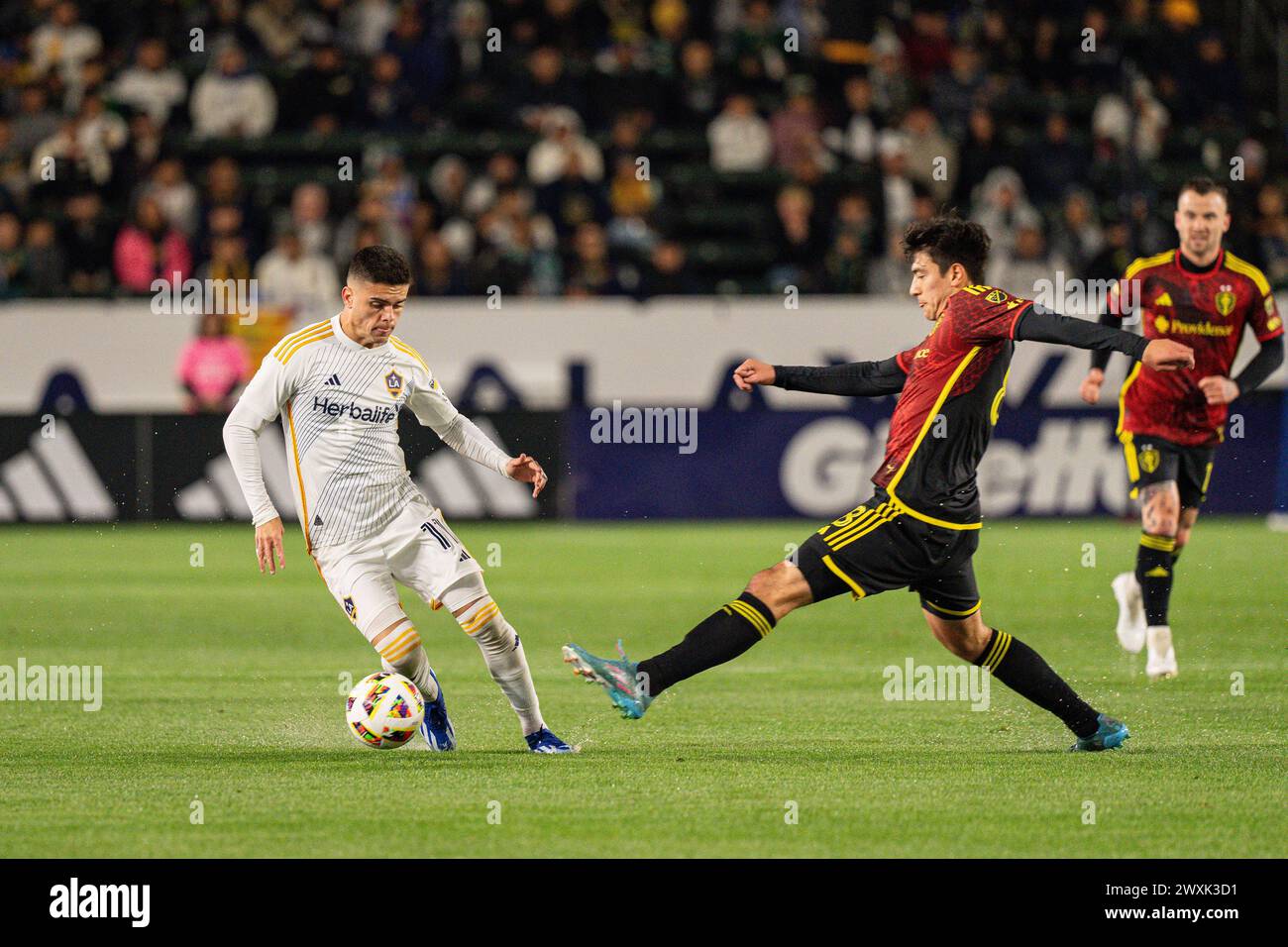 Los Angeles Galaxy forward Gabriel Pec (11) is defended by Seattle ...