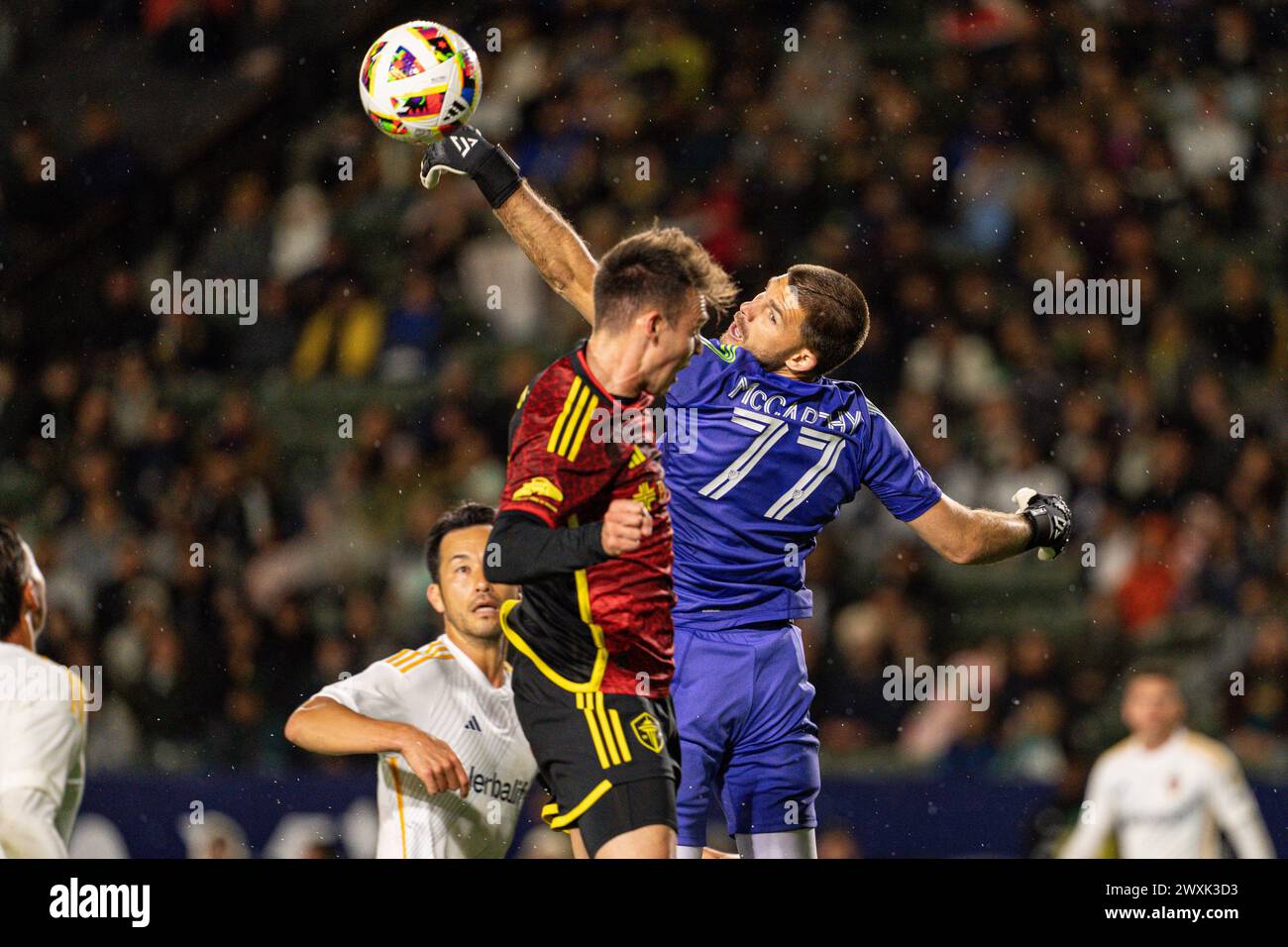 Los Angeles Galaxy goalkeeper John McCarthy (77) punches out a corner ...