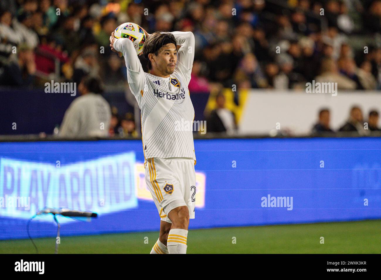 Los Angeles Galaxy defender Miki Yamane (2) throws in a pass during a ...