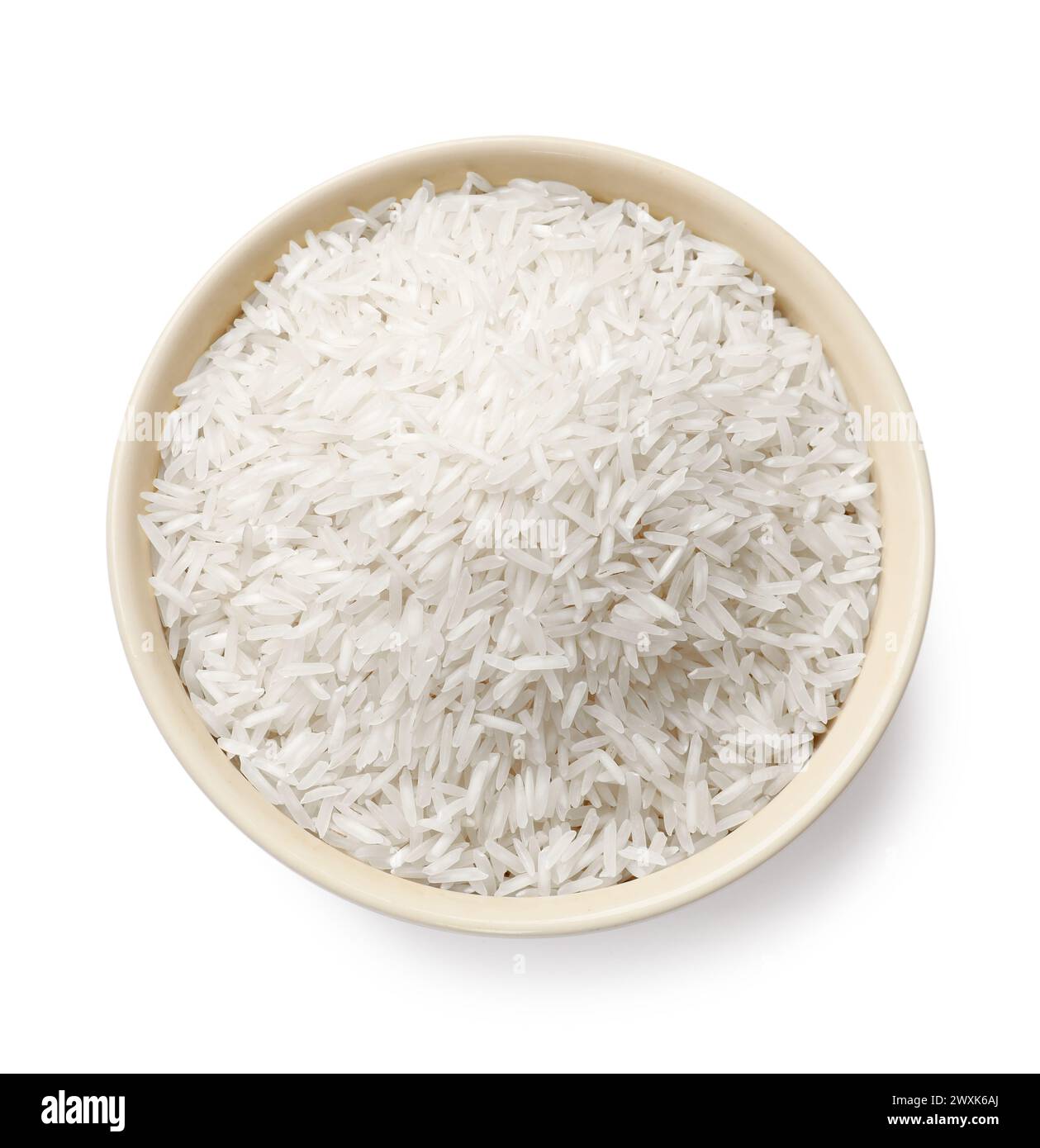 Raw basmati rice in bowl isolated on white, top view Stock Photo - Alamy