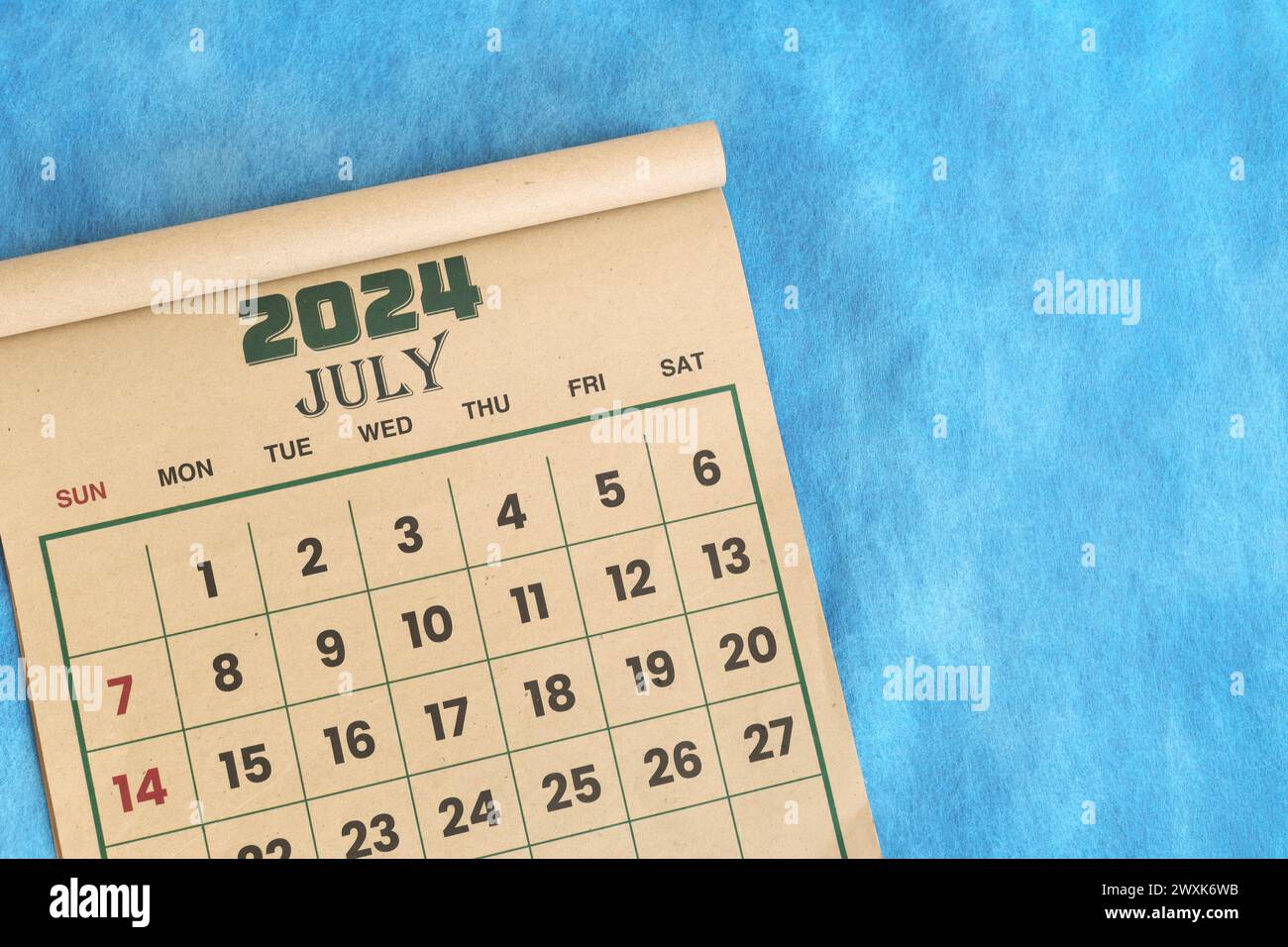 July 2024 calendar flat lay in blue background with copy space Stock ...