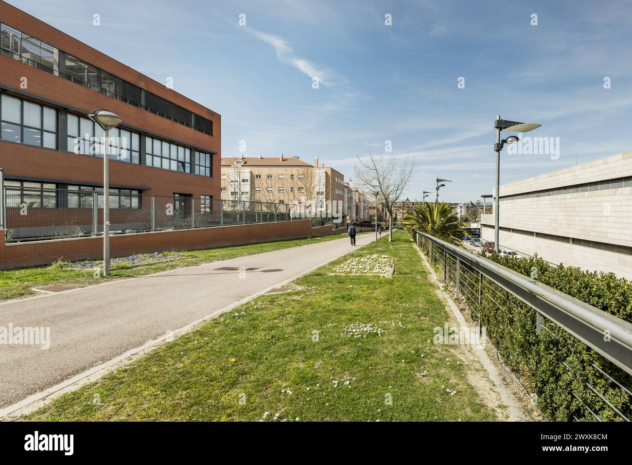 Terracotta brick and black metal facade of office building with a ...