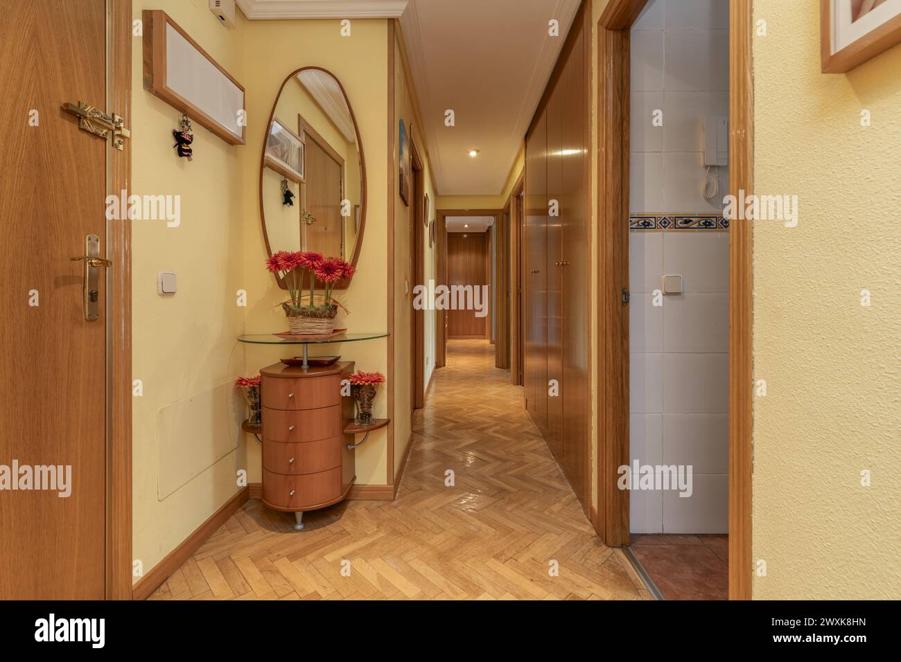 One-story hall with parquet floors, yellow walls with gotelet paint ...