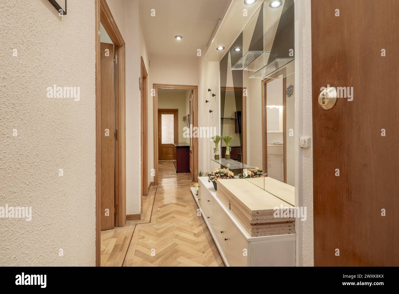 Entrance hall to house with reinforced wooden door, white wooden ...