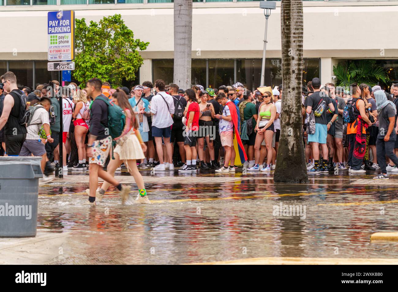Miami, FL, USA - March 23, 2024: Crowds of people waiting to get into ...