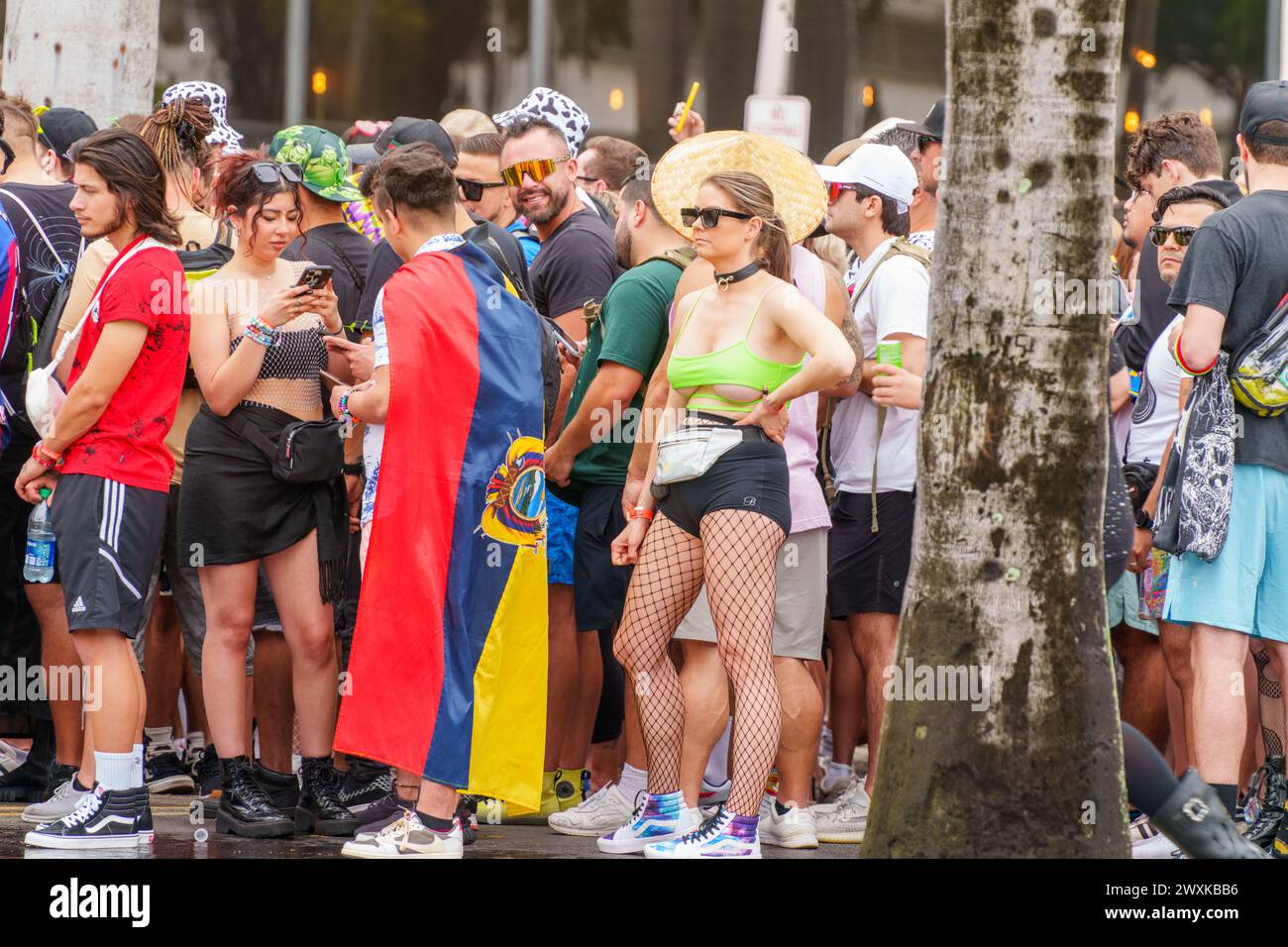 Miami, FL, USA - March 23, 2024: Crowds of youth people waiting to get ...
