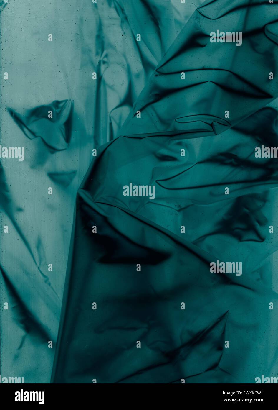 Old film. Wrinkled foil. Blue light color creasy material metallic ...