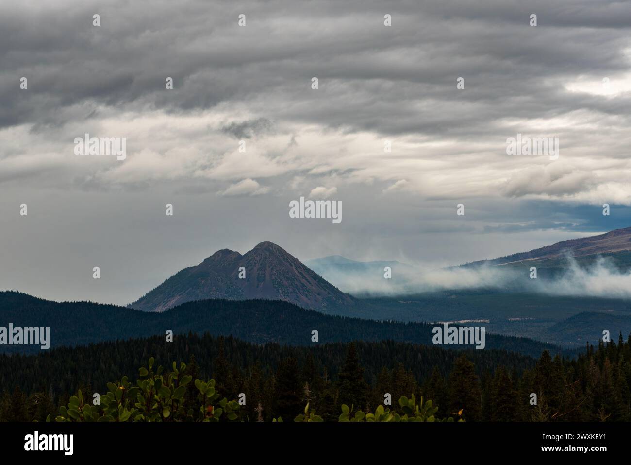 Mount Shastina on a partly cloudy day and viewed from a distance, and ...