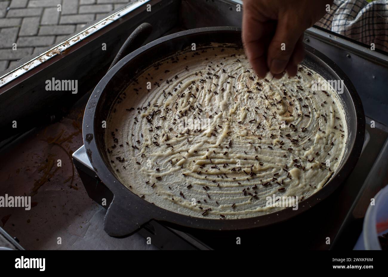 Making leker cakes or crepes, Indonesian traditional snacks made from ...
